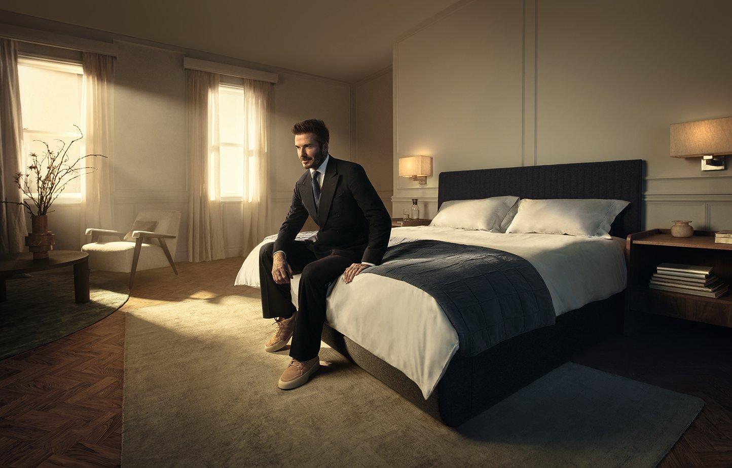 David Beckham sitting on Tempur bed